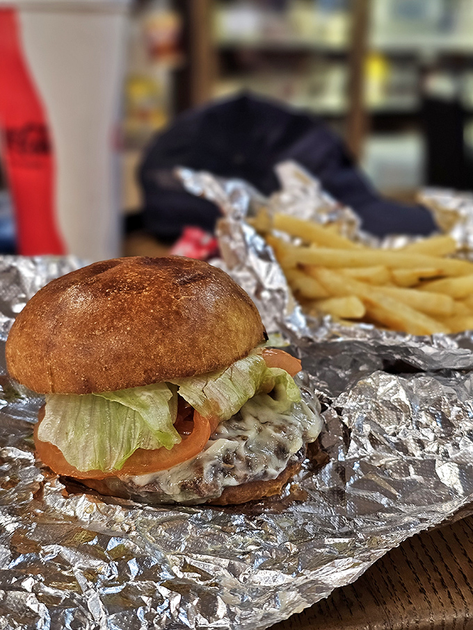 This isn't just a burger&mdash;it's edible architecture with the perfect ratio of meat to toppings. The foil wrapper doubles as a treasure map.