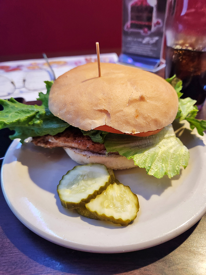 This sandwich isn't playing games. Fresh bun, crisp lettuce, and a pickle sidekick that knows its supporting role perfectly.