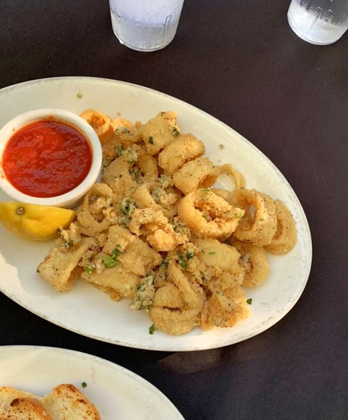 Calamari so perfectly crisp you'll forget all those rubbery disappointments from lesser establishments. The marinara dipping sauce deserves its own fan club.