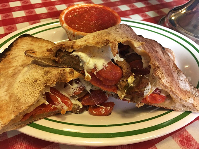 The calzone: pizza's mysterious cousin that keeps all the good stuff hidden inside like a delicious Italian treasure chest.