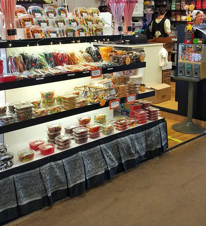 The candy stand&mdash;where childhood memories are stacked in colorful rows and diets go to die with dignity and a sugar-coated smile.