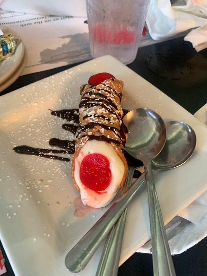 Not all heroes wear capes, but this cannoli wears a chocolate drizzle and cherry crown fit for Italian royalty. 