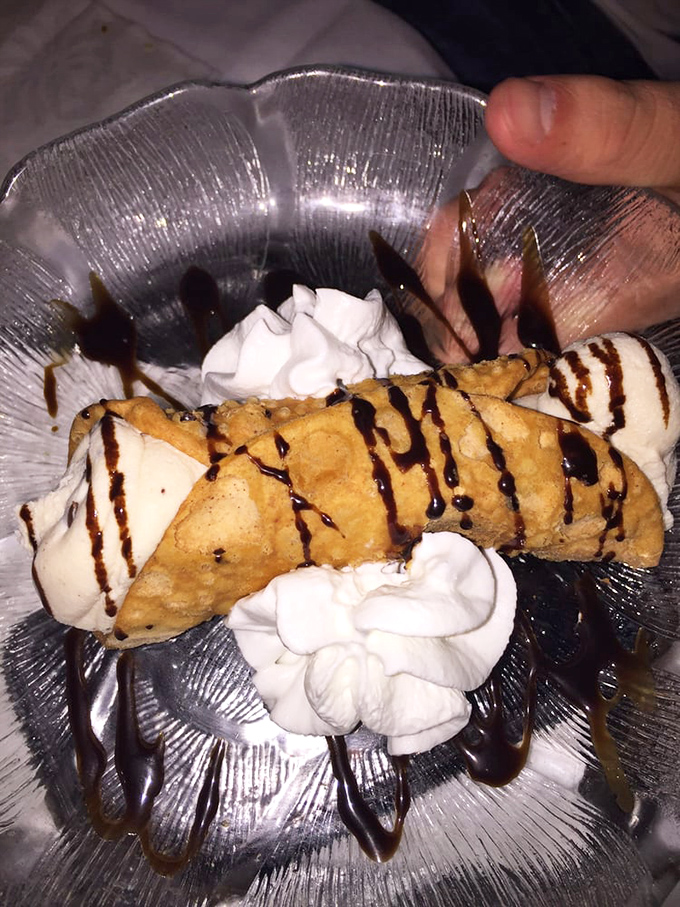 Not all cannoli are created equal. This crisp shell filled with sweetened ricotta and drizzled with chocolate is what dessert dreams are made of.