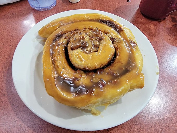 This cinnamon roll isn't just breakfast&mdash;it's dessert masquerading as a morning meal, complete with rivers of caramel icing.