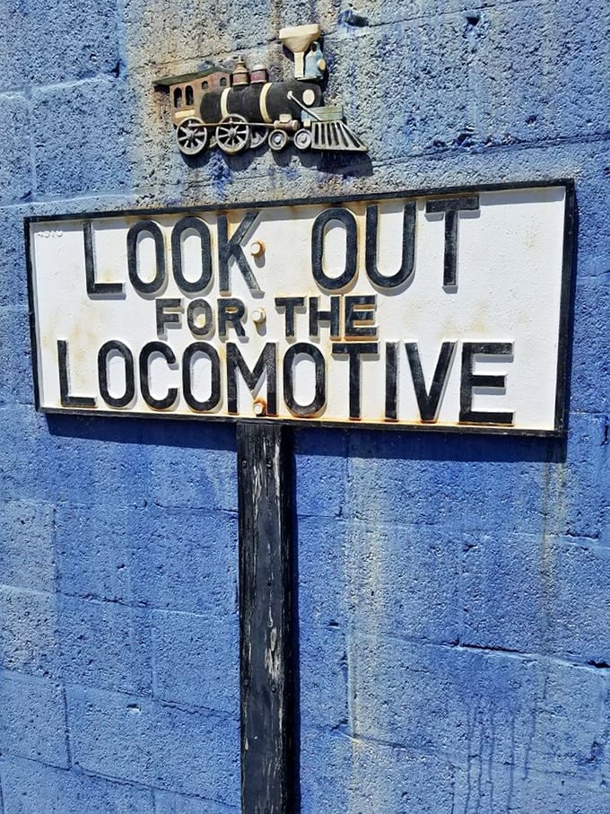 Look out for the locomotive&mdash;sage advice from this vintage railway sign that adds a touch of authentic railroad culture to the museum experience.