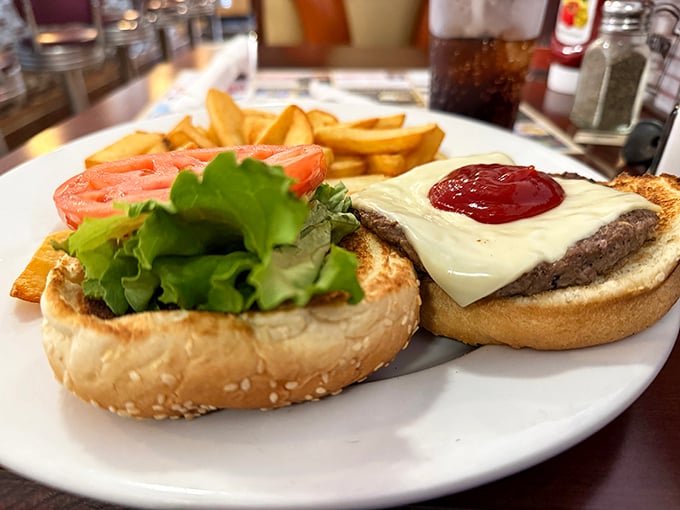 The cheeseburger &ndash; humanity's greatest invention after fire and the wheel. This beauty comes with perfectly golden fries that demand to be savored.