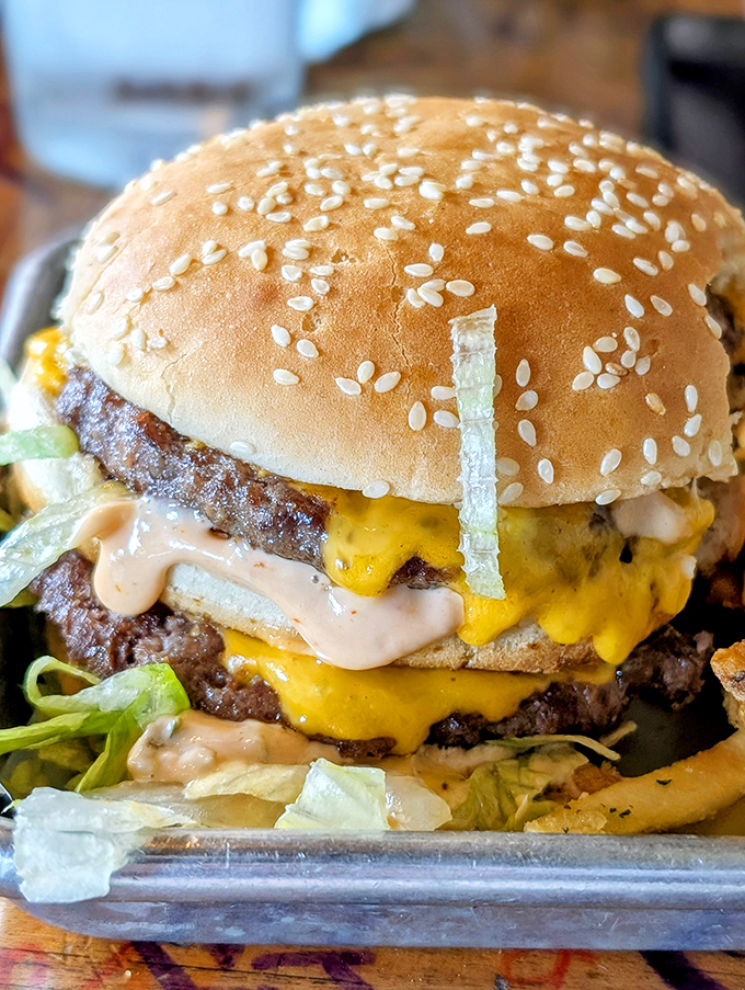 This isn't just a burger&mdash;it's an architectural marvel of beef, cheese, and special sauce that requires both hands, several napkins, and zero shame.