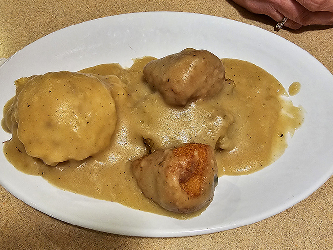 Chicken croquettes swimming in savory gravy&mdash;the kind of dish your grandmother would approve of and secretly wish she'd made.