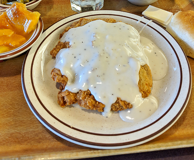 Chicken fried steak swimming in creamy gravy&mdash;the Texas state dish that's worth every extra minute on the treadmill tomorrow.