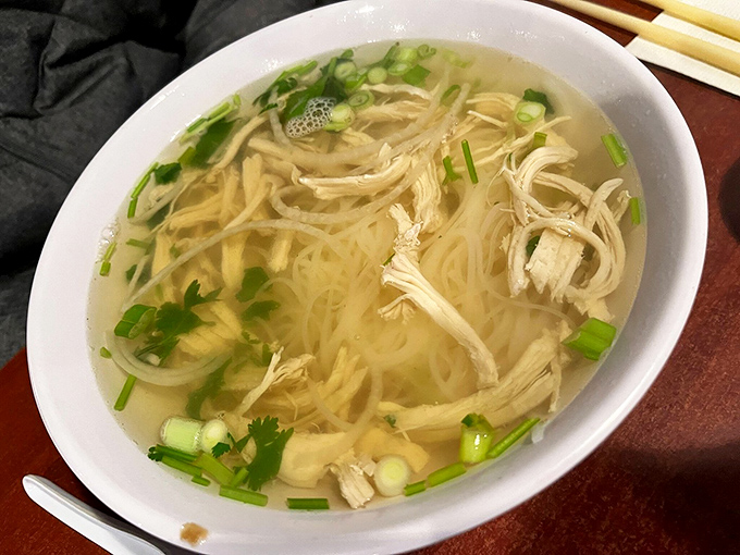 A bowl of chicken noodle soup that could make your grandmother nervous about her family recipe ranking. Clear broth, tender chicken, and noodles that know their place.