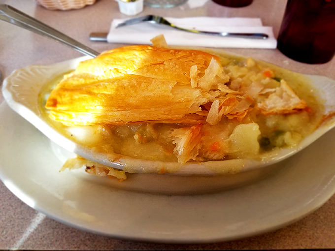 This chicken pot pie isn't just comfort food&mdash;it's a warm hug on a plate, with flaky pastry revealing a steamy treasure of chicken and vegetables.