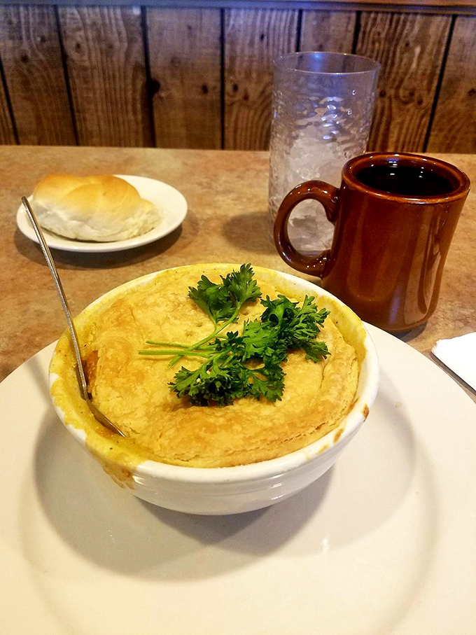 A chicken pot pie that rises like a golden dome of comfort, crowned with fresh parsley and paired with the kind of coffee that actually tastes like coffee.