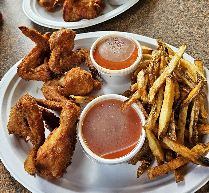 These wings and drumettes aren't trying to be Buffalo or Nashville hot&mdash;they're proudly Barberton, served with that signature tomato-pepper sauce that defies categorization.