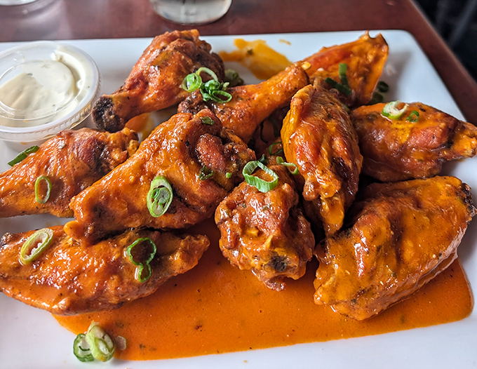 These aren't just wings; they're flavor vehicles delivering saucy satisfaction with each bite. The green onion garnish adds that touch of "see, there's a vegetable!"