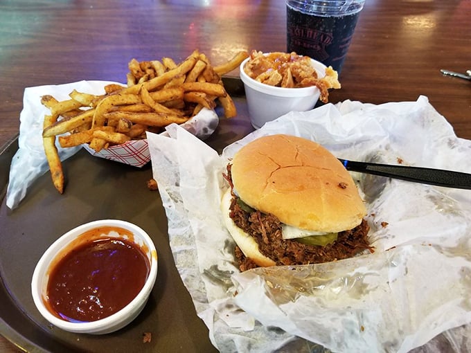 The legendary chopped pork sandwich in its natural habitat&mdash;surrounded by crispy fries and a side of that magical sauce that haunts your dreams.
