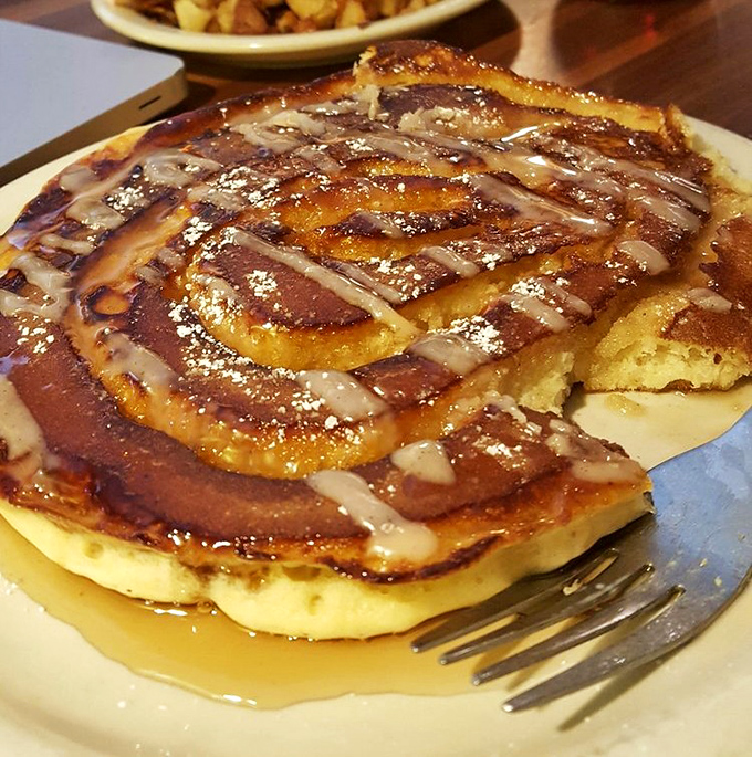 These pancakes aren't just breakfast, they're an architectural achievement of golden, syrupy perfection.
