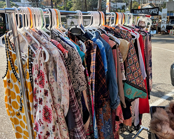 The clothing rack rainbow: where patterns from five decades collide and your next conversation starter hangs in plain sight.