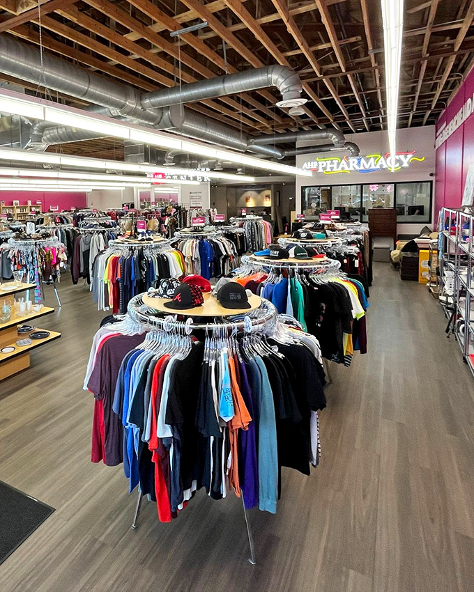 Circular racks organized by color create a rainbow effect that makes browsing feel like a treasure hunt rather than a chore.