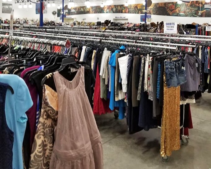 A rainbow of fabrics tells a thousand stories. Each garment waits for its second act, from delicate lace dresses to everyday denim ready for new adventures.