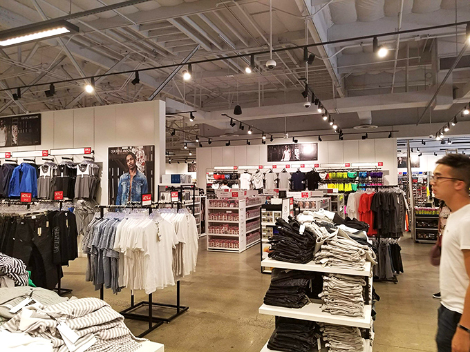 Clean lines and minimalist displays make this clothing store feel more like a high-end boutique than an outlet, proving bargains can be beautiful too.