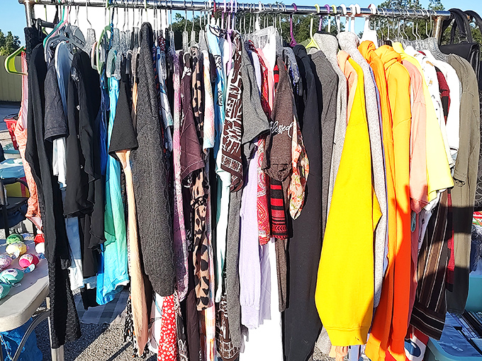 The clothing racks tell stories through fabric—each garment waiting for its second act in someone else's wardrobe revolution.