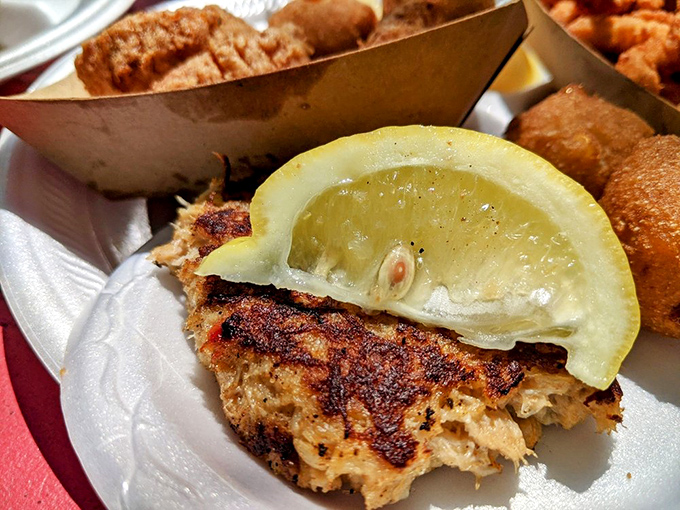 Meet the star of our show: a crab cake that's all crab, barely held together by hope and minimal filler. That char marks the difference between good and transcendent.