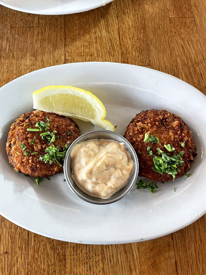 Golden-brown perfection! These crab cakes are what Neptune would serve at his dinner parties. The remoulade in the middle? That's the crown jewel.