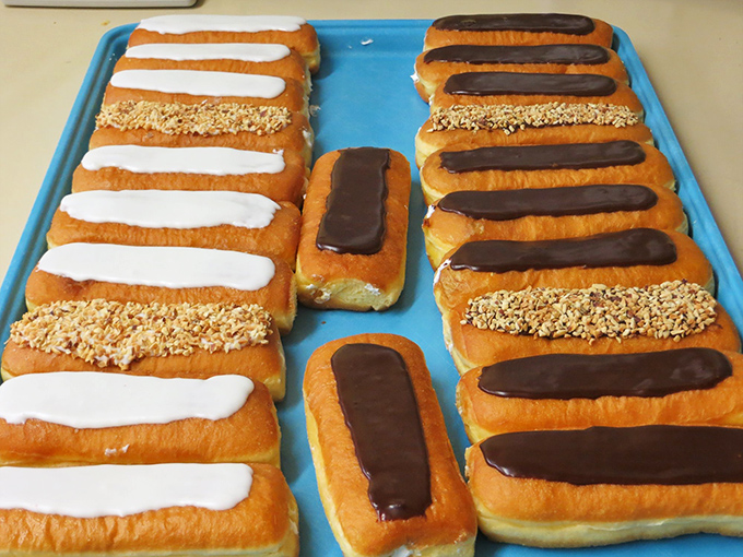 Long, rectangular donuts lined up like sugary soldiers, each topped with either chocolate, peanuts, or vanilla icing. Breakfast's answer to the runway fashion show.