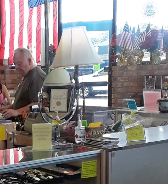 The checkout area, adorned with patriotic flair, where friendly faces transform your thrifting treasures from "someone else's" to officially "yours."