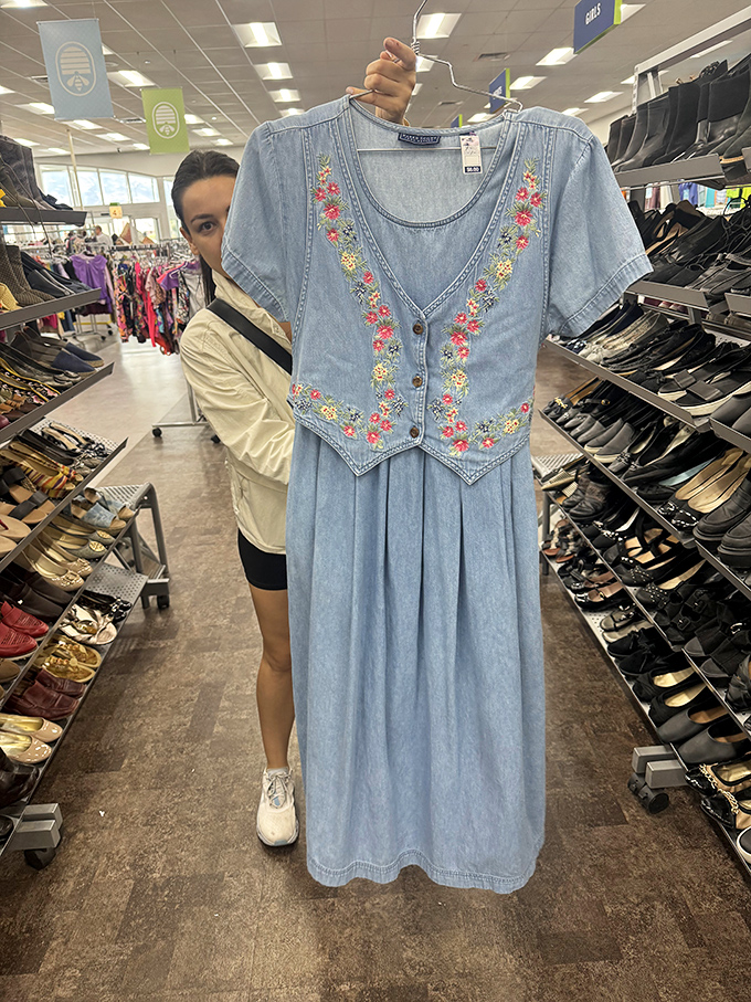 A shopper reveals her prize find: a denim dress with embroidered details that whispers "vintage charm" at a modern-day steal.