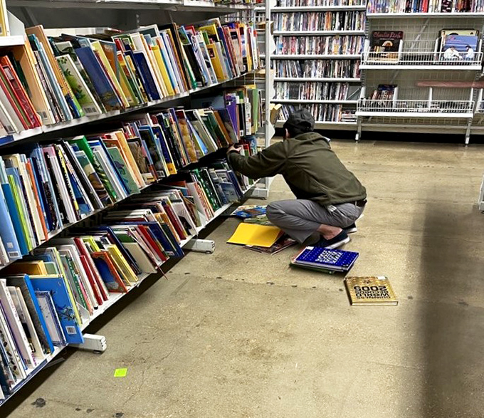 The book section: where literary treasure hunters crouch in concentration, mining for paperback gold among thousands of forgotten stories.