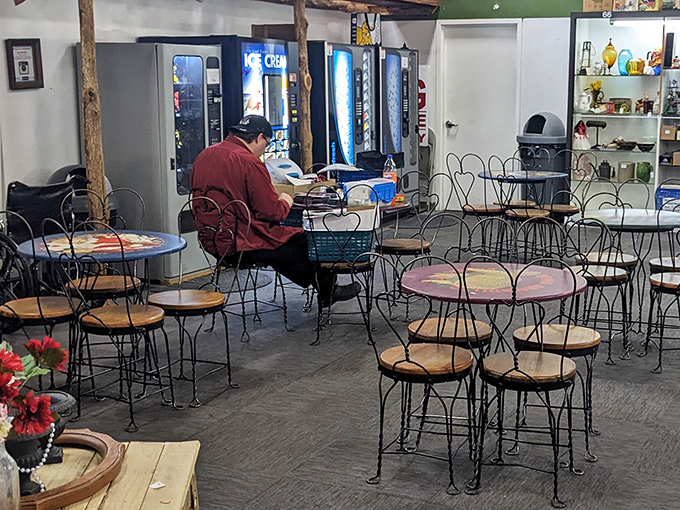 The unofficial Brass Armadillo caf&eacute;&mdash;where shoppers rest weary feet among vintage ice cream parlor furniture while plotting their next antiquing conquest.