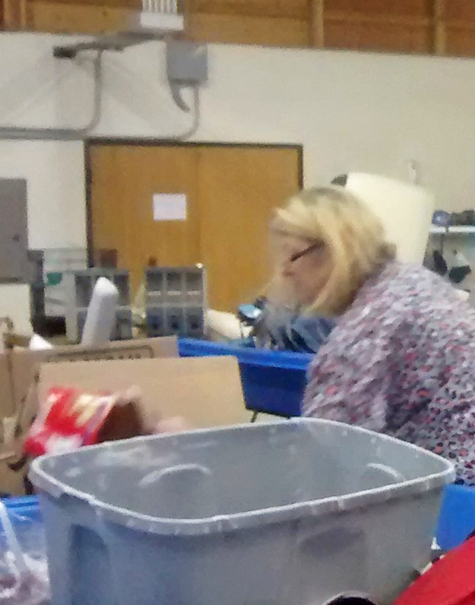 The serious bin-diver in action, employing techniques perfected over countless treasure hunts. Notice the focused concentration of a professional at work.