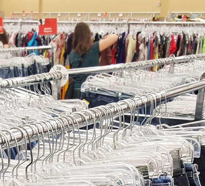 The thrill of the hunt captured in action. Each rack holds potential discoveries that could become tomorrow's favorite outfit.