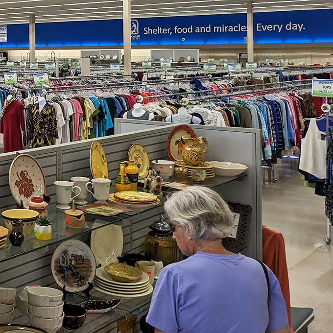 "Shelter, food and miracles. Every day." The store's mission statement hangs above racks of carefully organized dishware that once graced someone else's table.