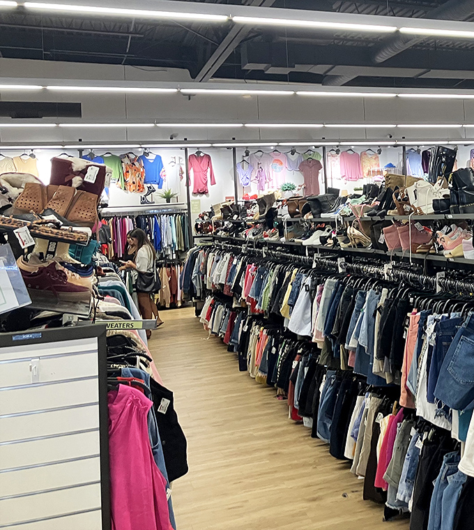 Shoes above, clothes below&mdash;a vertical treasure map of fashion finds. The multi-level merchandising transforms limited space into a playground of possibilities.