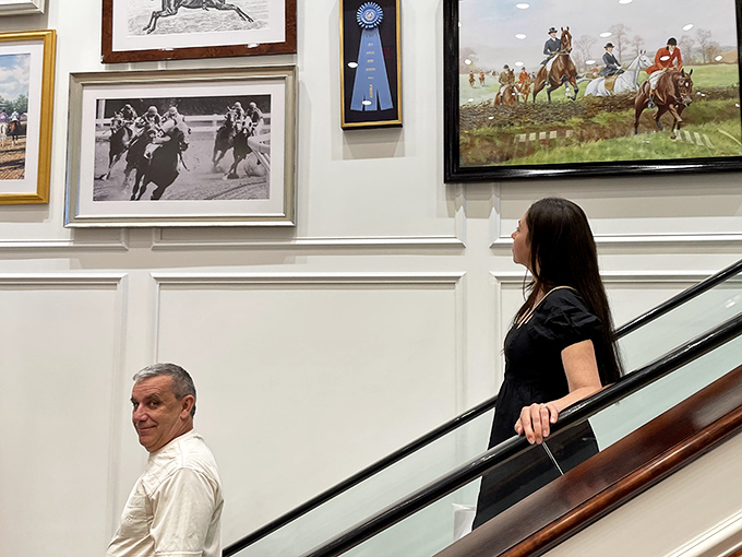 Inside the Ralph Lauren store, where equestrian artwork reminds you that yes, you too could look this good on a horse if you buy that discounted polo shirt.