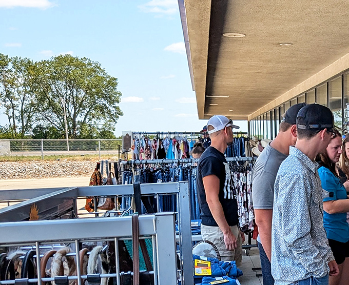 Shoppers browse outdoor racks where treasures hide in plain sight, waiting for their moment to shine.