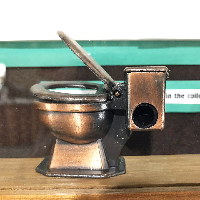 Yes, that's exactly what you think it is—a miniature toilet pencil sharpener. Proof that bathroom humor transcends all ages and eras.