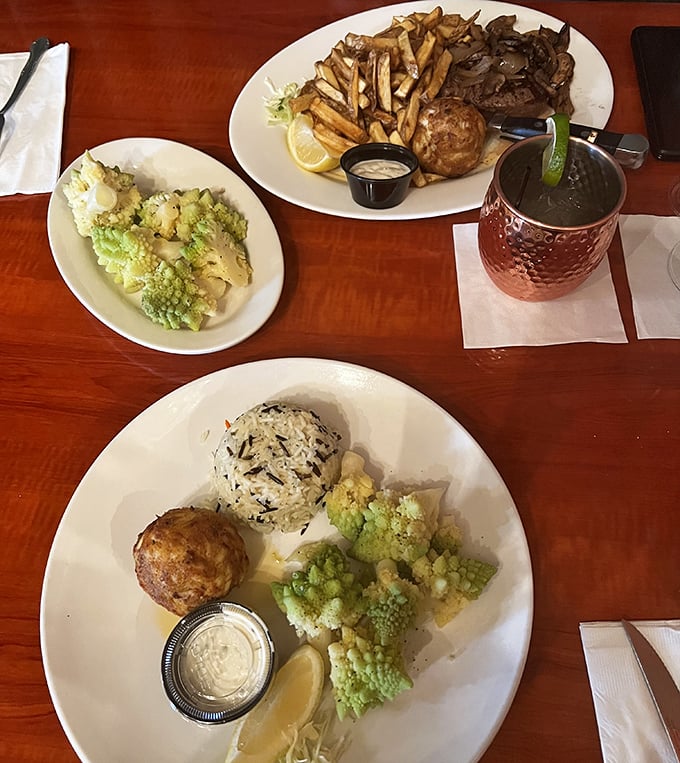 A symphony of textures: the delicate flakiness of crabcakes, the earthy comfort of wild rice, and vibrant broccoli creating a plate that's both nourishment and nostalgia.