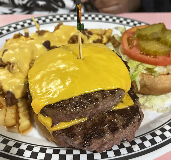 Behold the double cheeseburger in its natural habitat&mdash;draped in melted American cheese like a yellow security blanket for your taste buds.