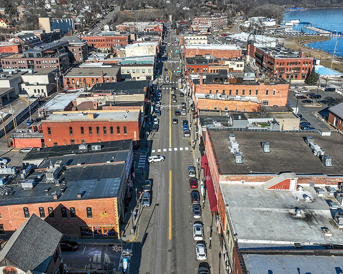 Main Street stretches toward the river like a timeline of American architecture, each brick building a chapter in the story of this historic lumber town.