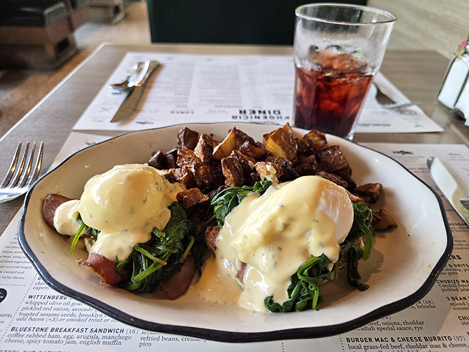 Eggs Benedict that would make a brunch snob weep with joy, where hollandaise sauce cascades like a yellow waterfall over perfectly poached eggs.