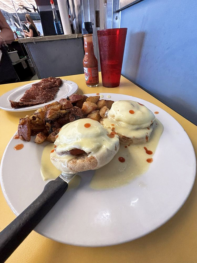 Eggs Benedict: where hollandaise dreams come true. Those perfectly poached eggs look like they're wearing little sauce jackets for the occasion.