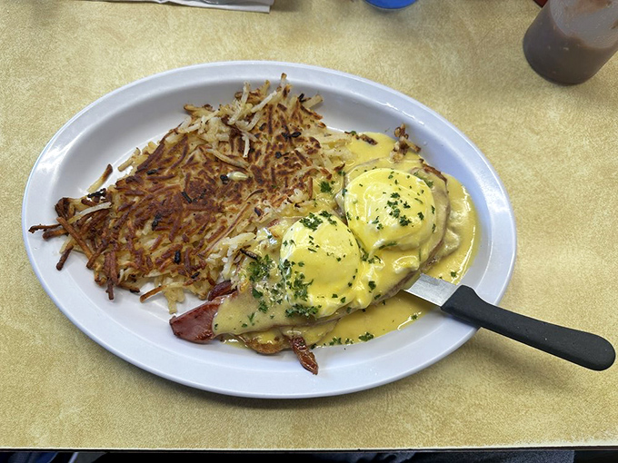 Eggs Benedict at Nick's: where hollandaise dreams and perfectly poached eggs meet crispy hash browns in breakfast harmony.