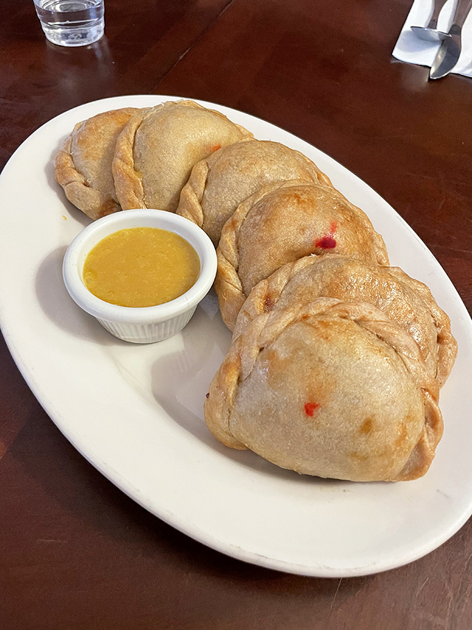 These empanadas aren't just pockets of goodness&mdash;they're edible treasure chests. The golden-brown exterior practically whispers "bite me" in the most family-friendly way possible.