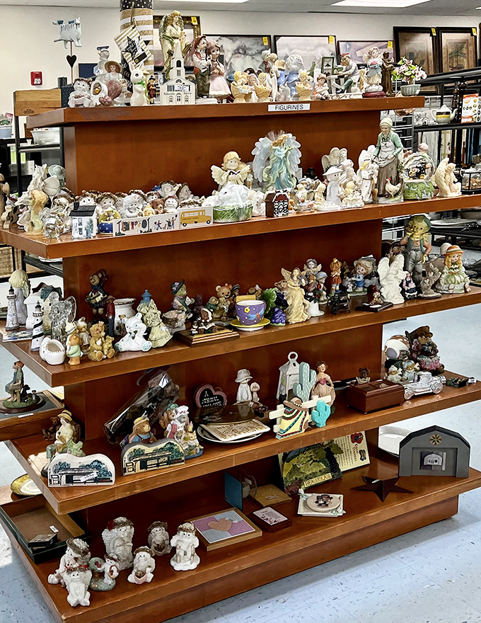 The figurine section: a miniature civilization frozen in porcelain and ceramic, each tiny face holding stories of windowsills they once adorned.