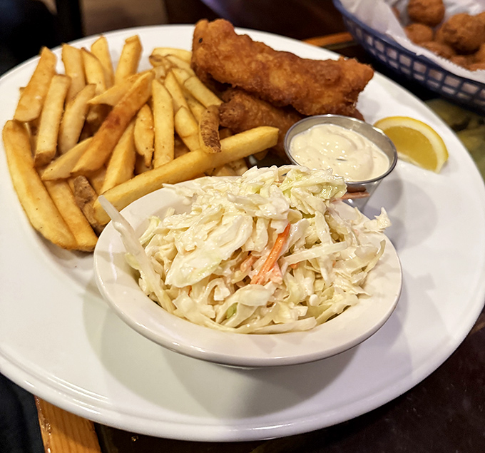 Fish and chips that would make the British weep with joy, accompanied by coleslaw so fresh it practically introduces itself.