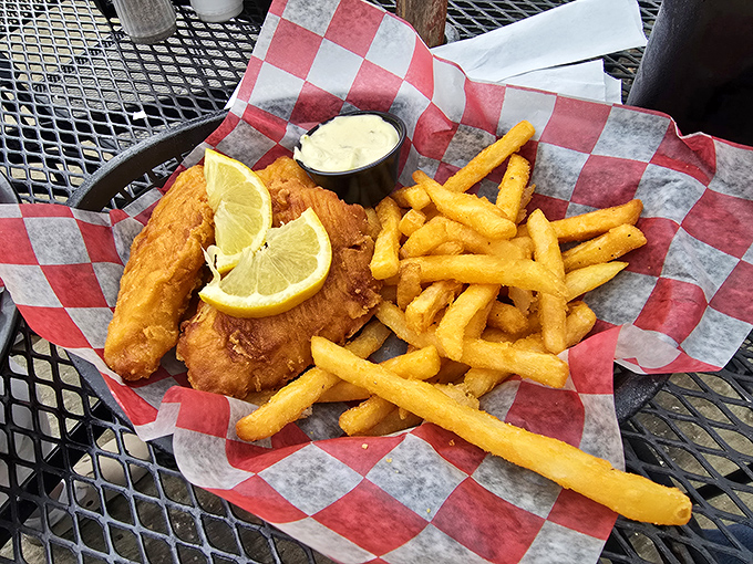 Golden perfection meets tartar sauce in a combination that would make any coastal grandmother beam with pure culinary pride.