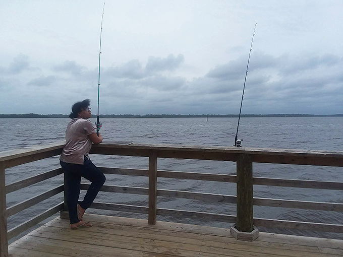 Patience pays dividends at the park's fishing spots. This angler knows that sometimes the best catch is the peaceful moment itself.